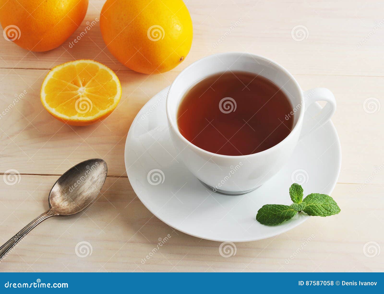 White Mug with Black Tea, Teaspoon, Lemon and Mint Stock Photo - Image ...