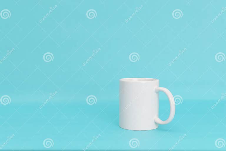 White Mug on a Blue Background Stock Image - Image of porcelain ...
