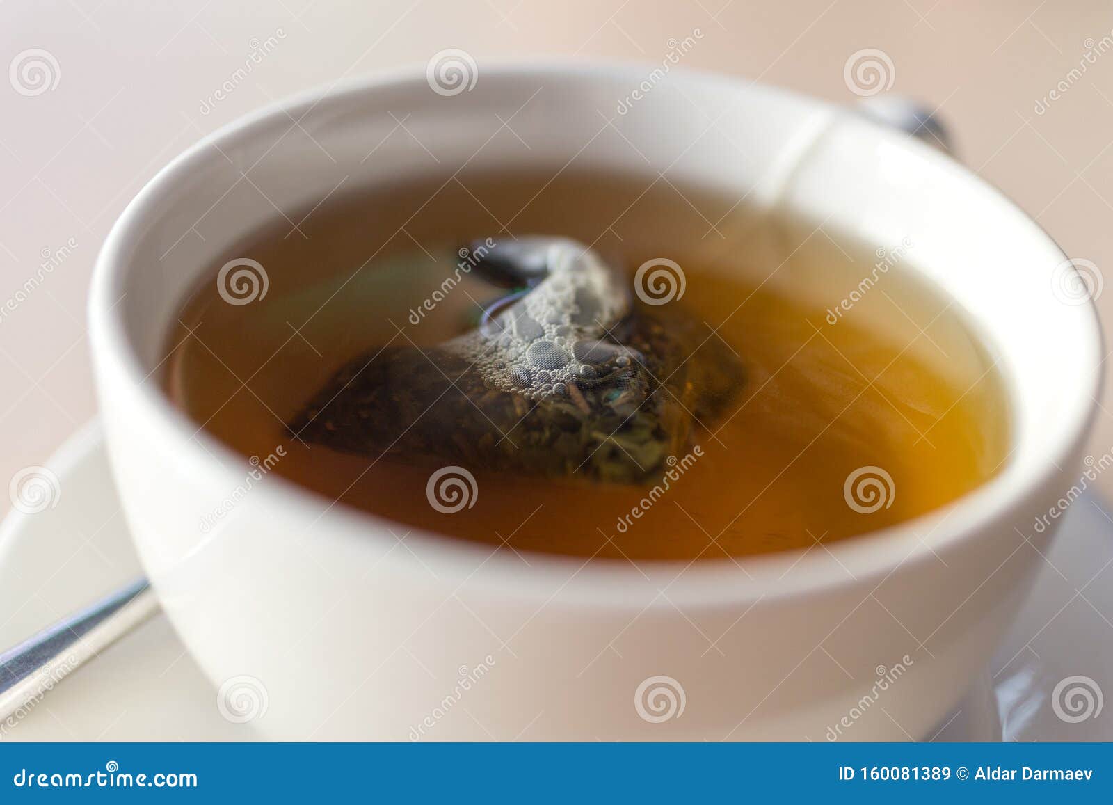 White Mug Cup of Herbal Green Tea with a Teabag Inside Close Up Stock ...