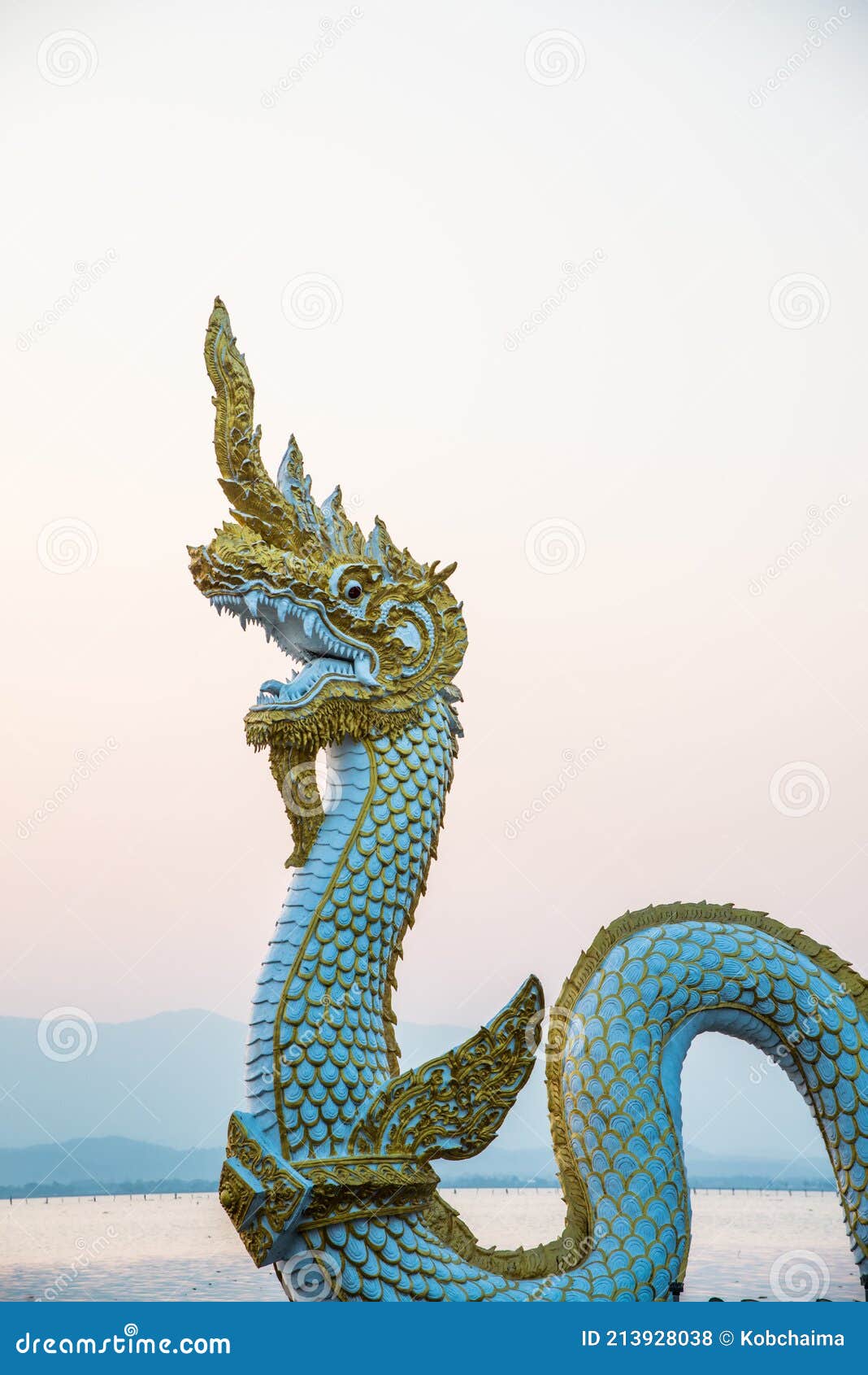 White Naga Statue at Kwan Phayao with Evening Sun Stock Photo - Image ...
