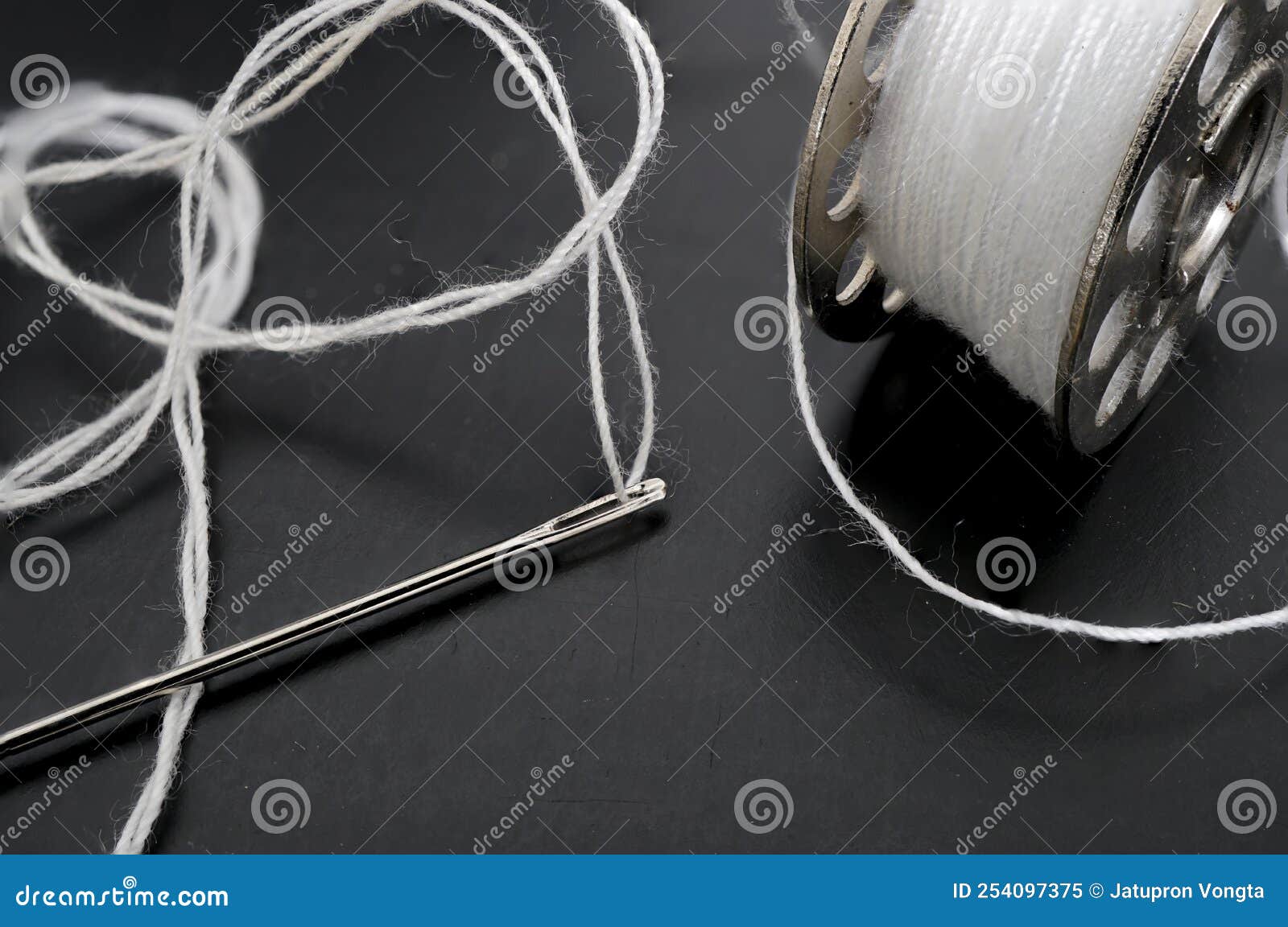 White Needle and Thread on a Black Background Stock Image - Image of ...