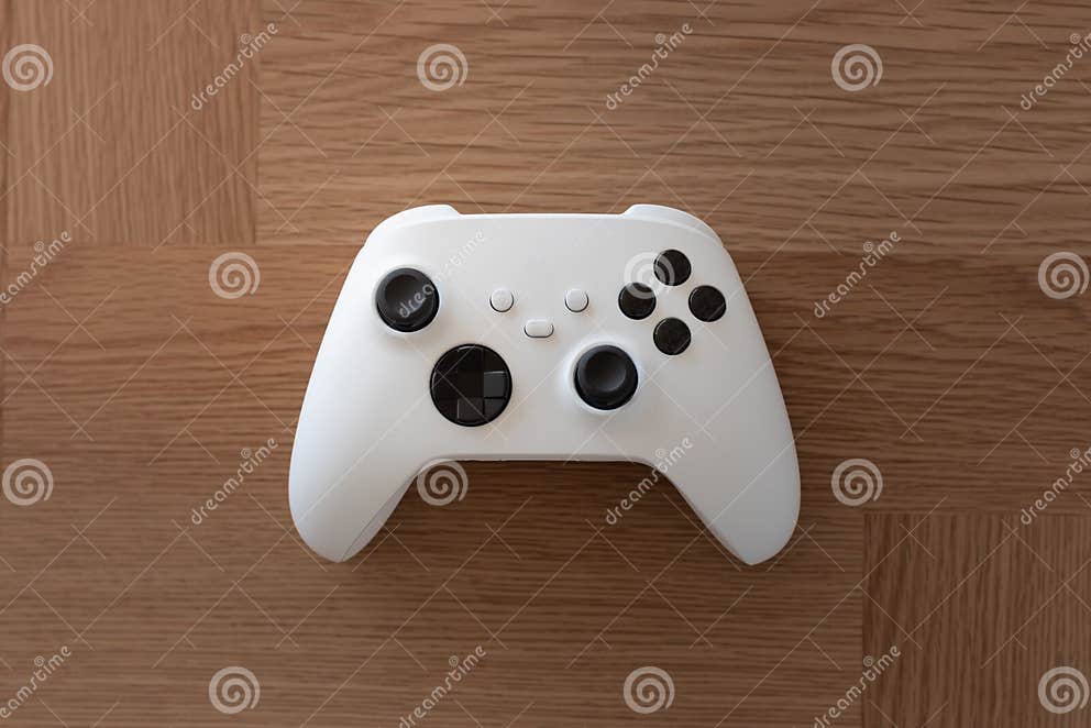 White Next Gen Controller on Oak Background. Stock Image - Image of ...