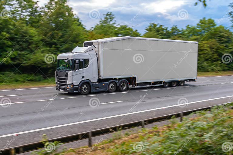 White No Name Double Decker Lorry in Motion on the Motorway. Stock ...
