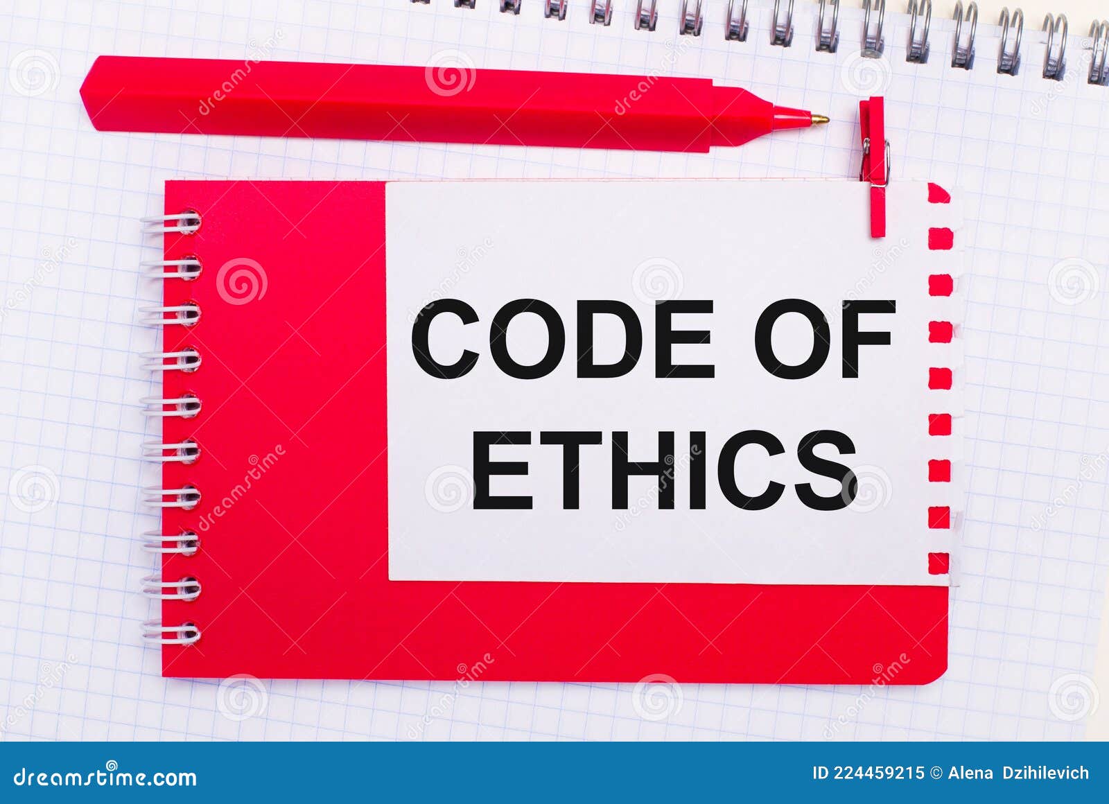 On a White Notepad, a Red Pen, a Red Notepad and a White Sheet of Paper ...