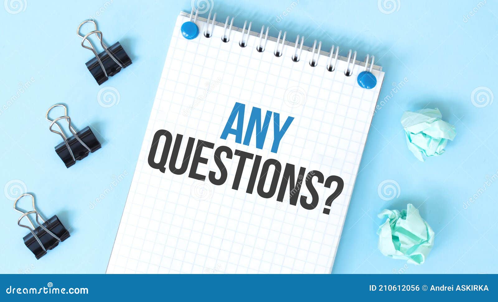 White Notepad with Text ANY QUESTIONS and Office Tools on the Blue ...