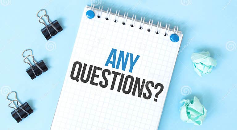 White Notepad with Text ANY QUESTIONS and Office Tools on the Blue ...