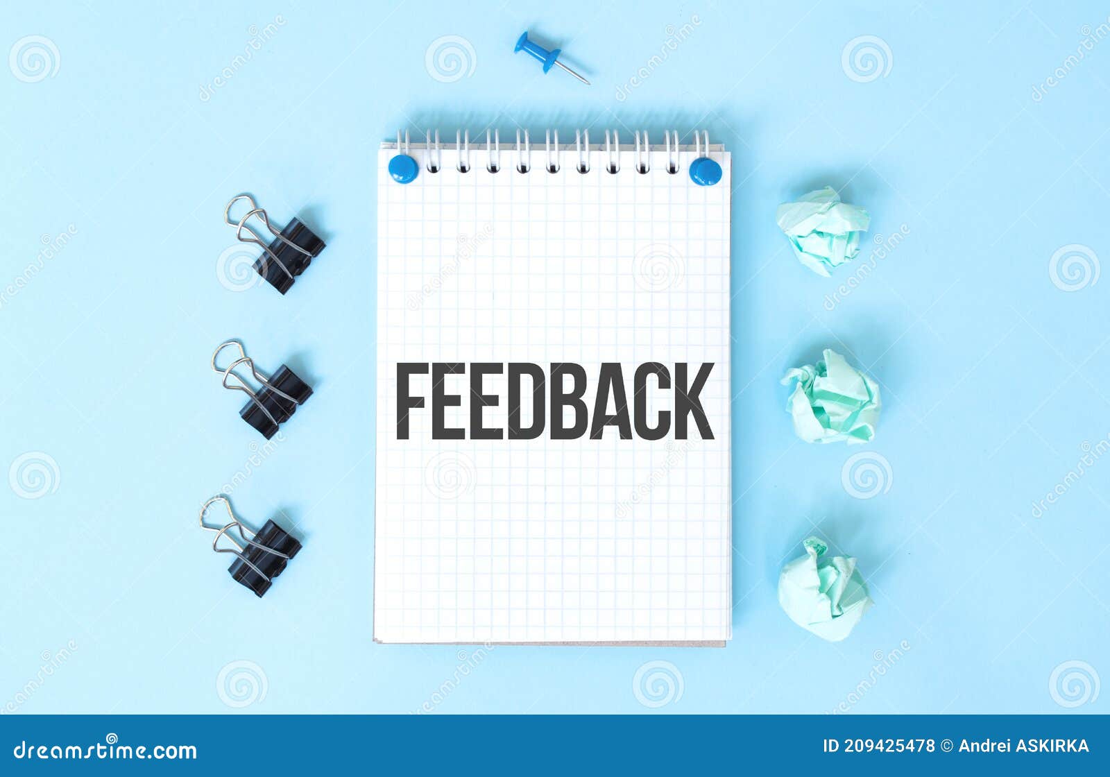 White Notepad with Text FEEDBACK and Office Tools on the Blue ...