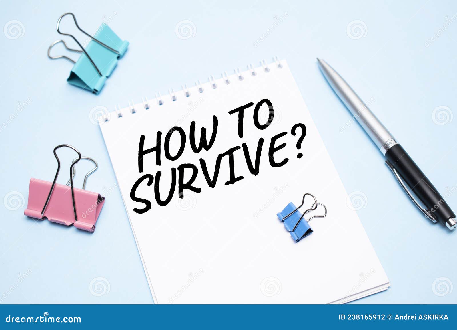 White Notepad with Text How To Survive and Office Tools on the Blue ...
