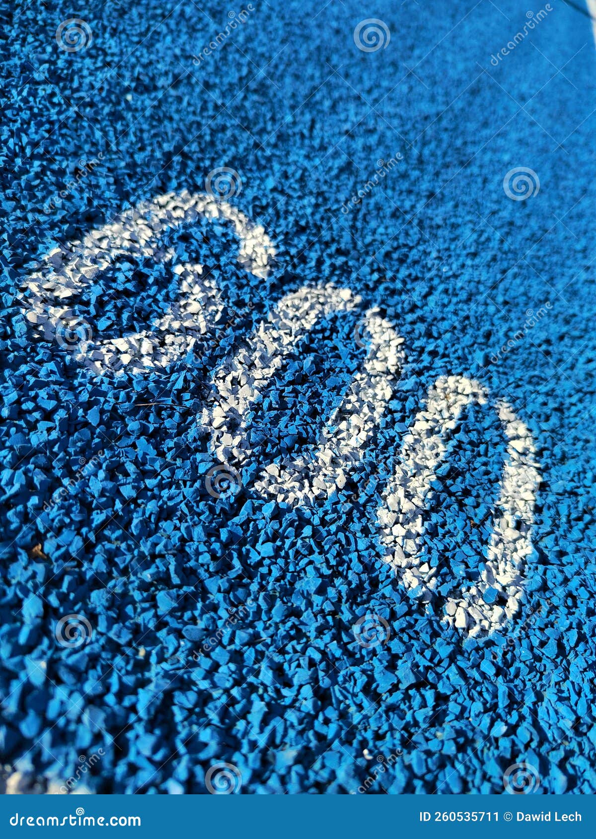 White 600 Number on Blue Tartan Running Track Stock Image - Image of ...