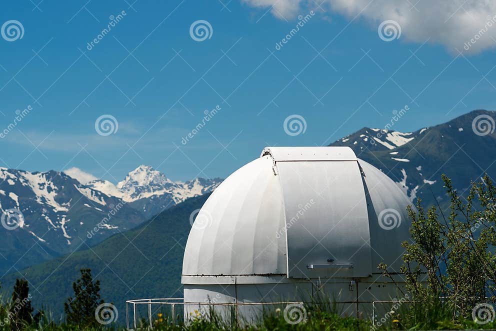 White Observatory Dome with Snowy Mountains in the Background Stock ...