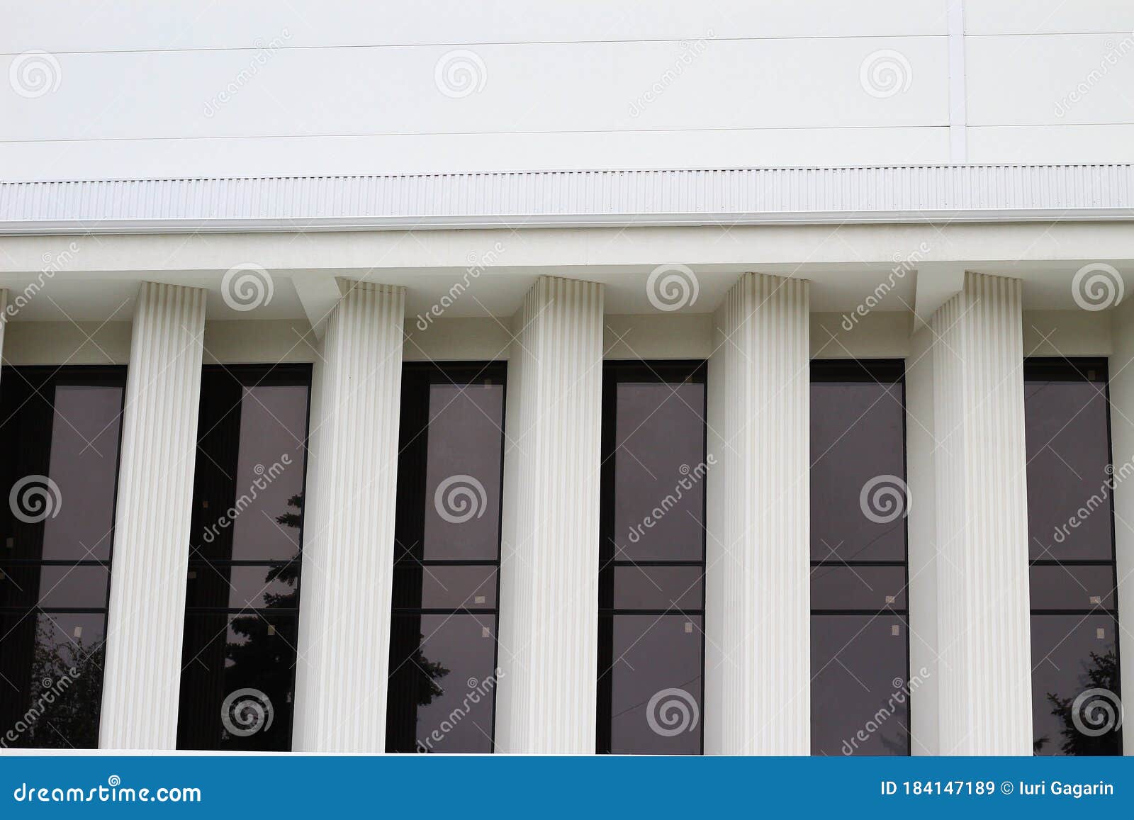White Office Building with Columns and Tinted Windows Stock Image ...