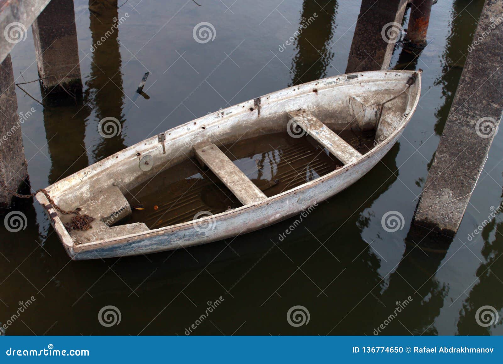 White Old Leaky Boat Half in the Water on the River Stock Photo - Image ...