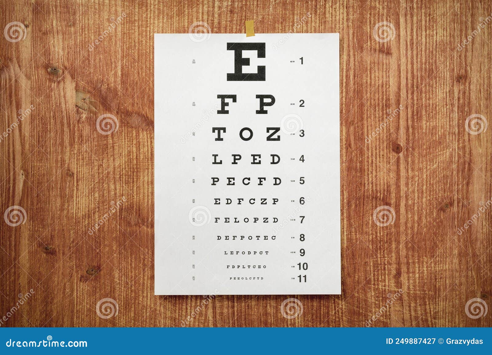 White Optometry Chart on the Wooden Wall Stock Image - Image of ...