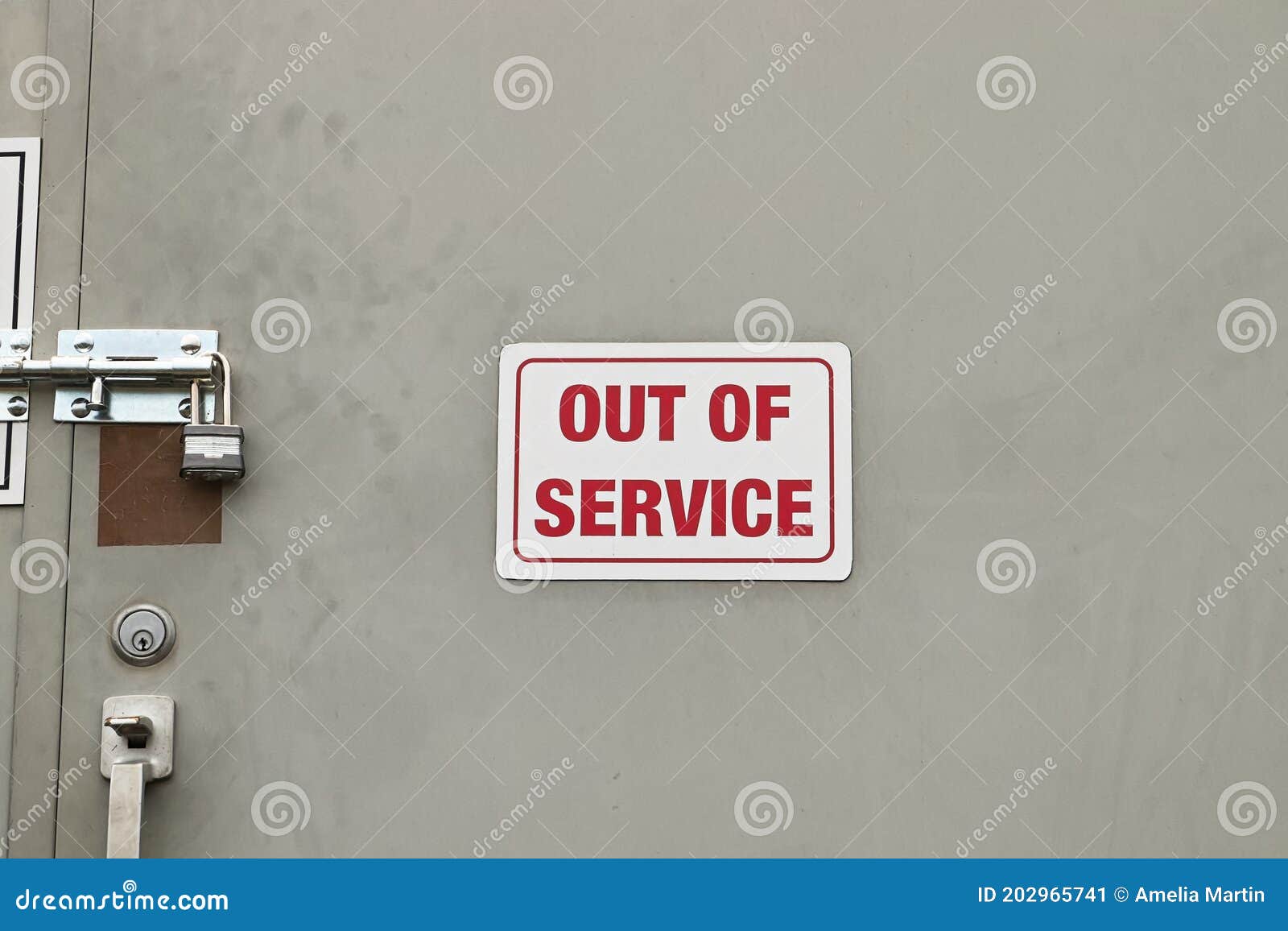 A White Out of Service Sign on a Locked Door Stock Image - Image of ...