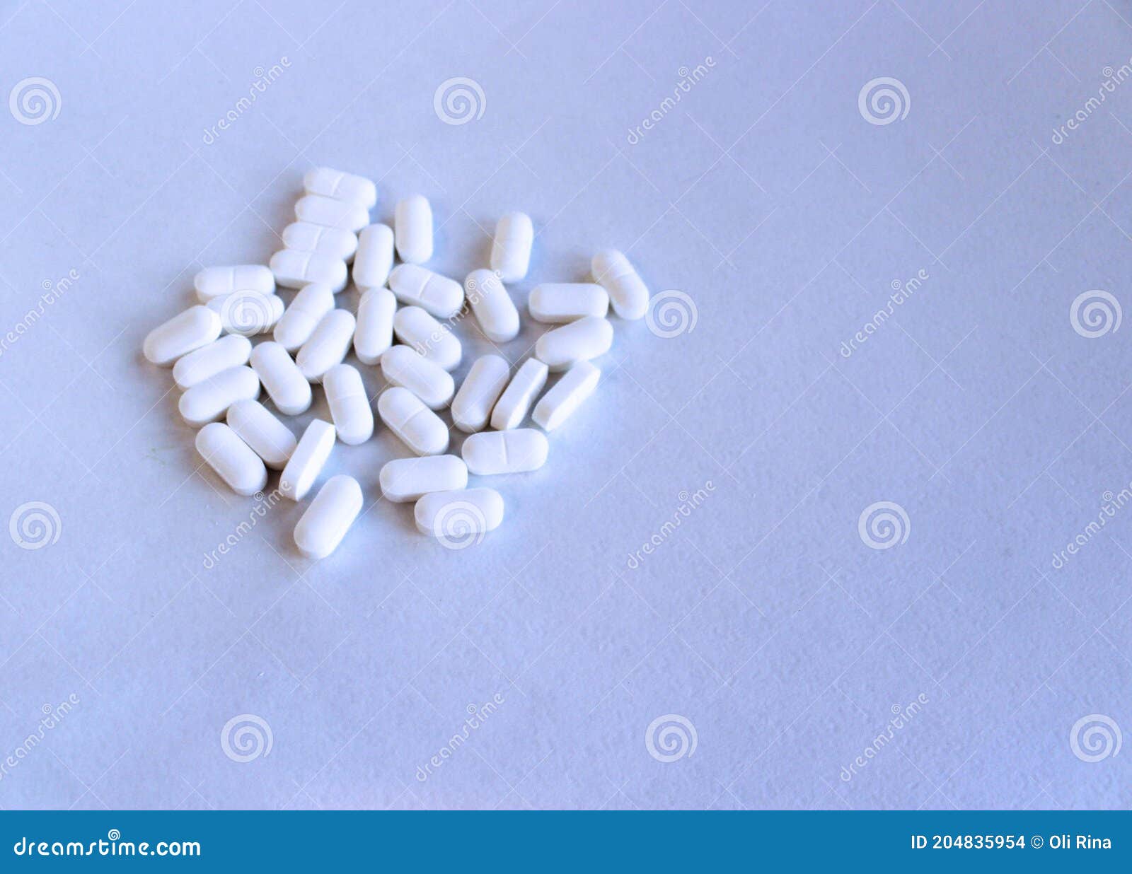 White Oval Tablets Isolated on a White Background. Stock Photo - Image ...