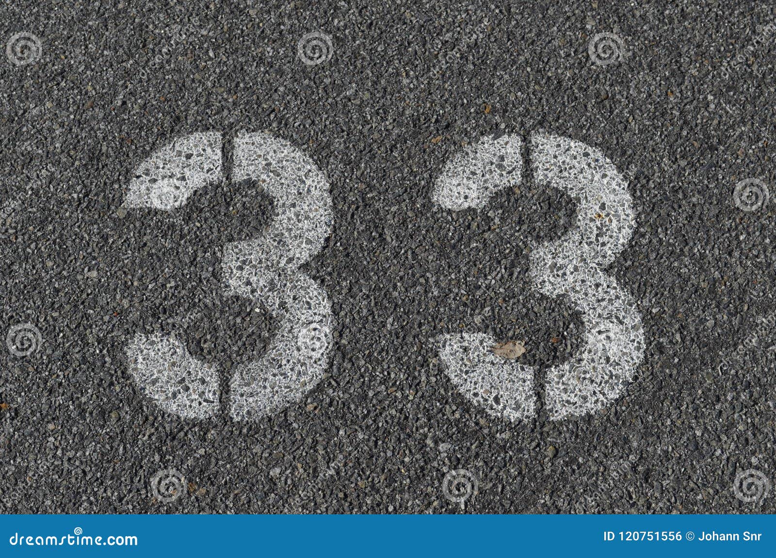 White 33 painted on tar stock photo. Image of white - 120751556