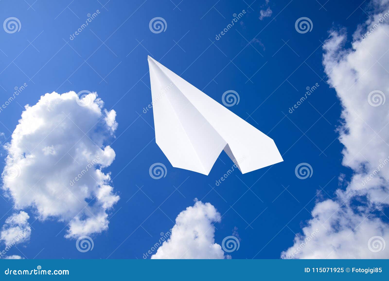 White Paper Airplane in a Blue Sky with Clouds. the Message Symbol in ...