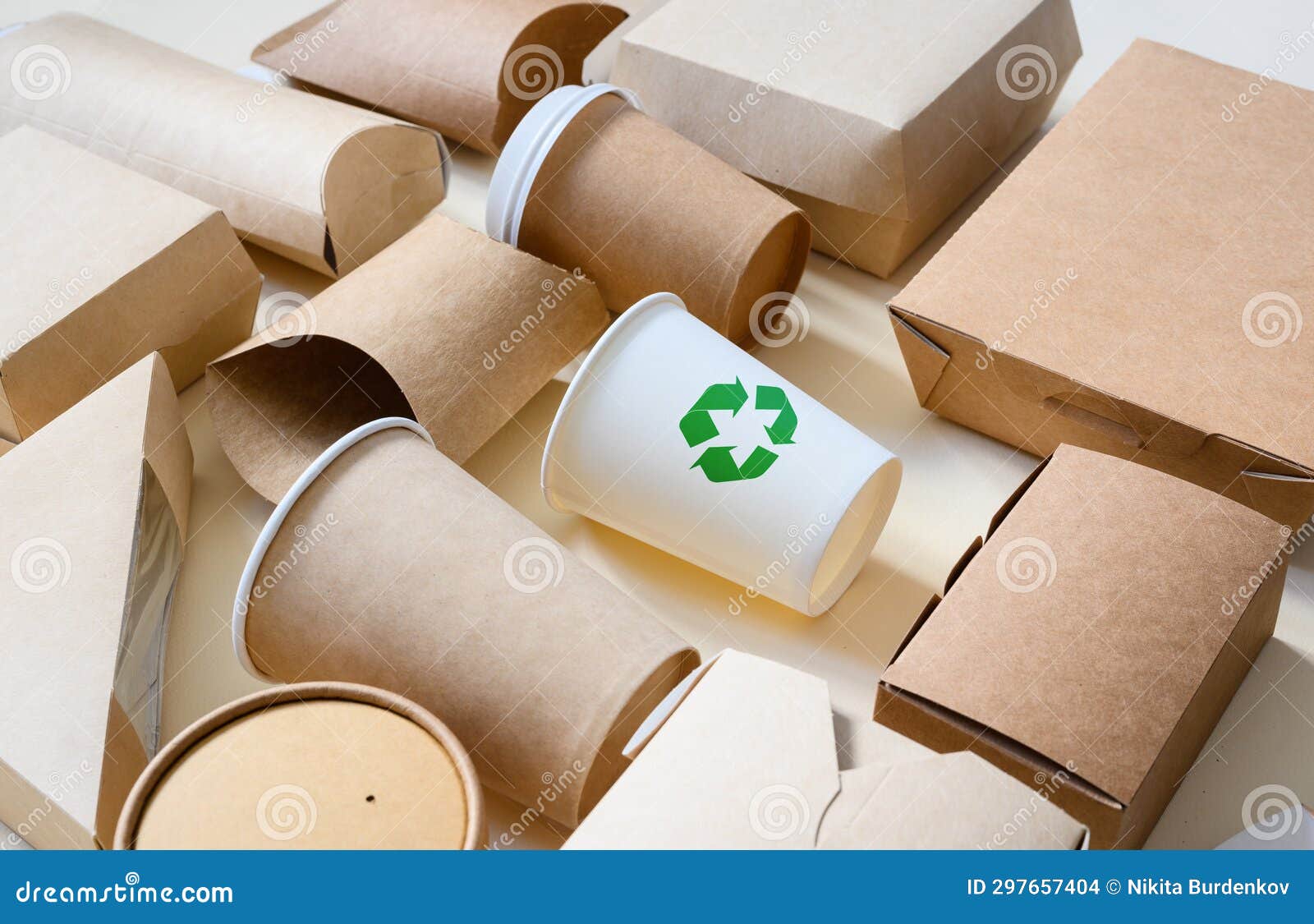 A White Paper Cup with a Recycling Sign and a Lot of Disposable Eco ...
