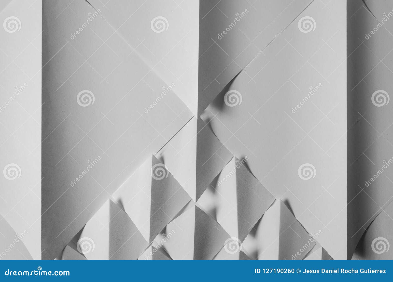 White Paper Folded into Square and Triangular Shapes Stock Photo ...