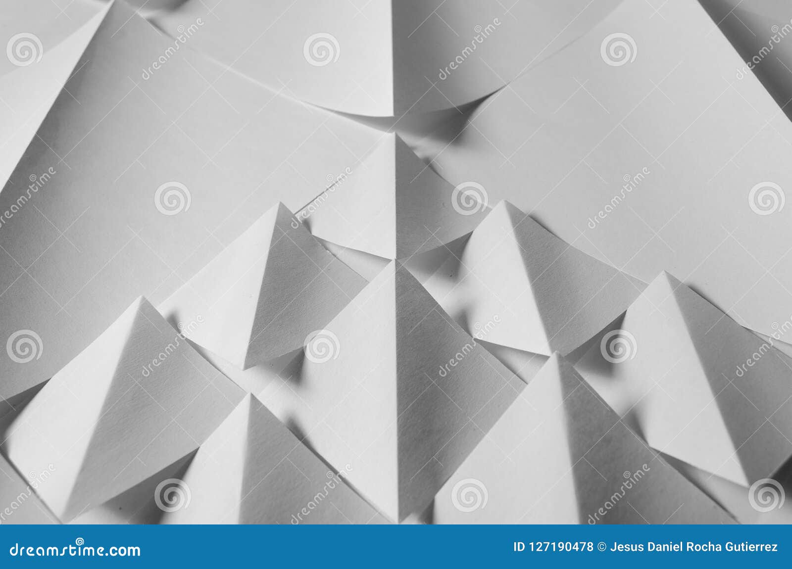 White Paper Folded into Square and Triangular Shapes Stock Photo ...
