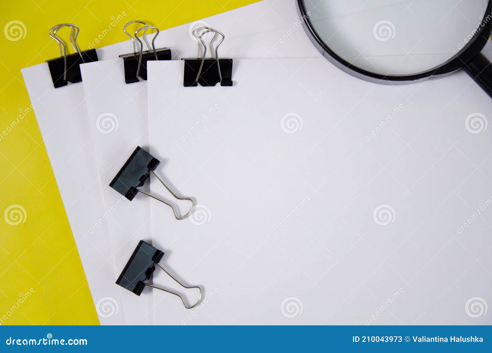 White A4 Paper, Magnifier, Which Lie on Yellow Paper Stock Image ...