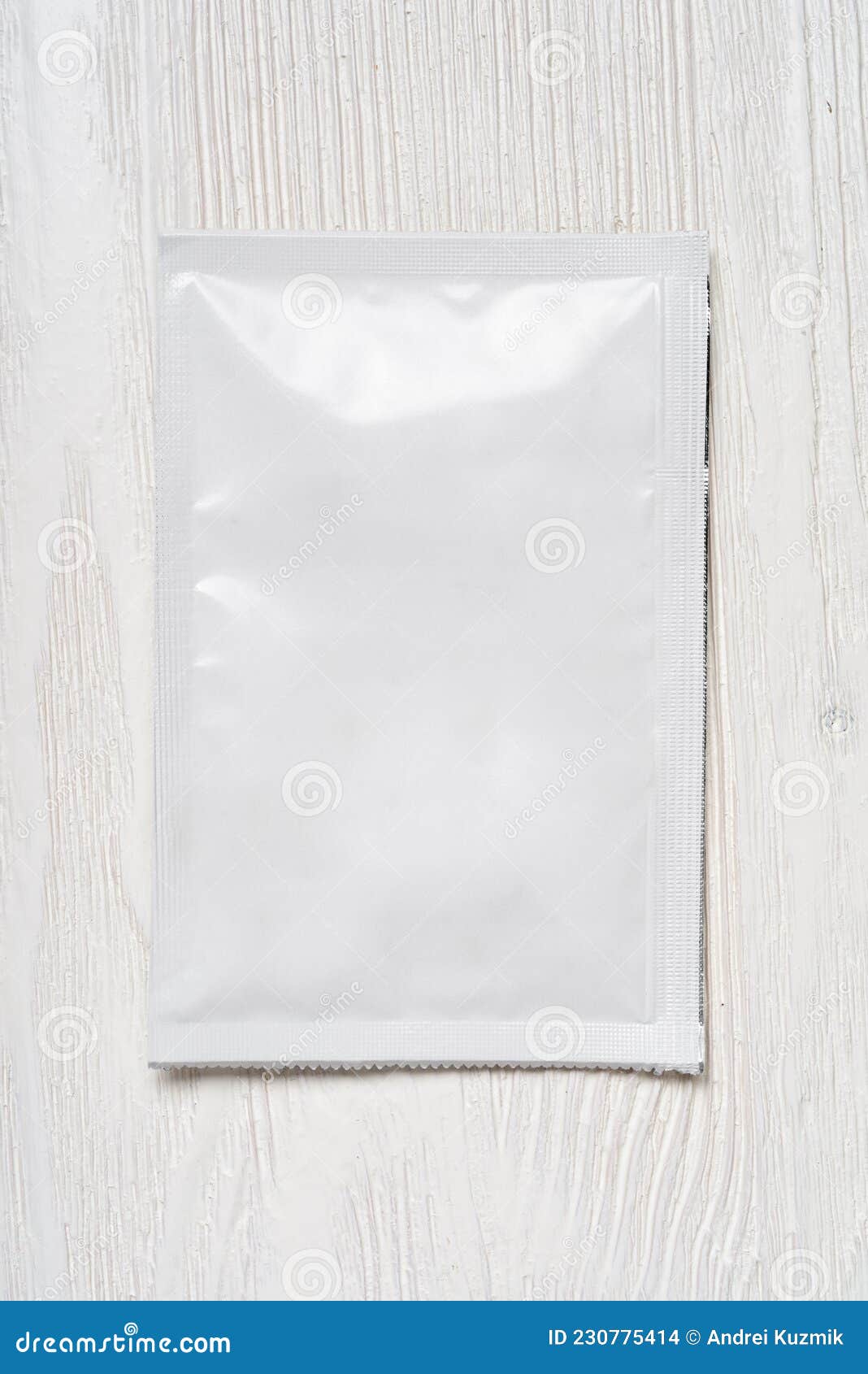 White Paper Sachet Packet on Wood Table Stock Photo - Image of design ...