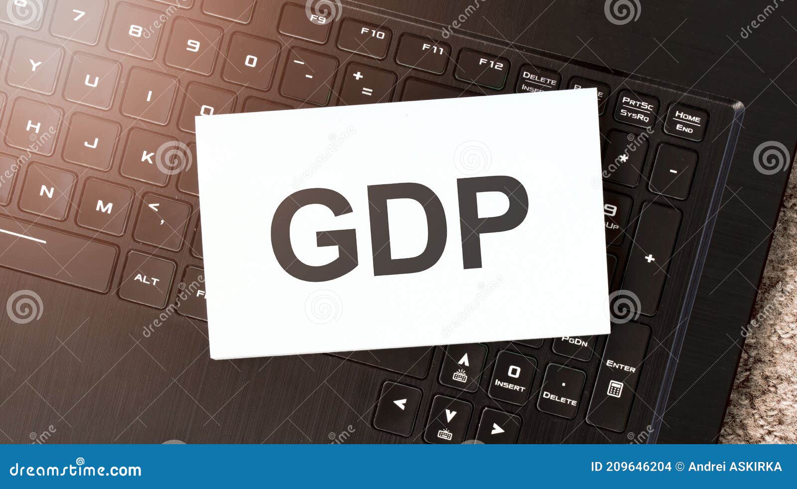 White Paper Sheet with Text GDP on the Black Laptop Stock Photo - Image ...