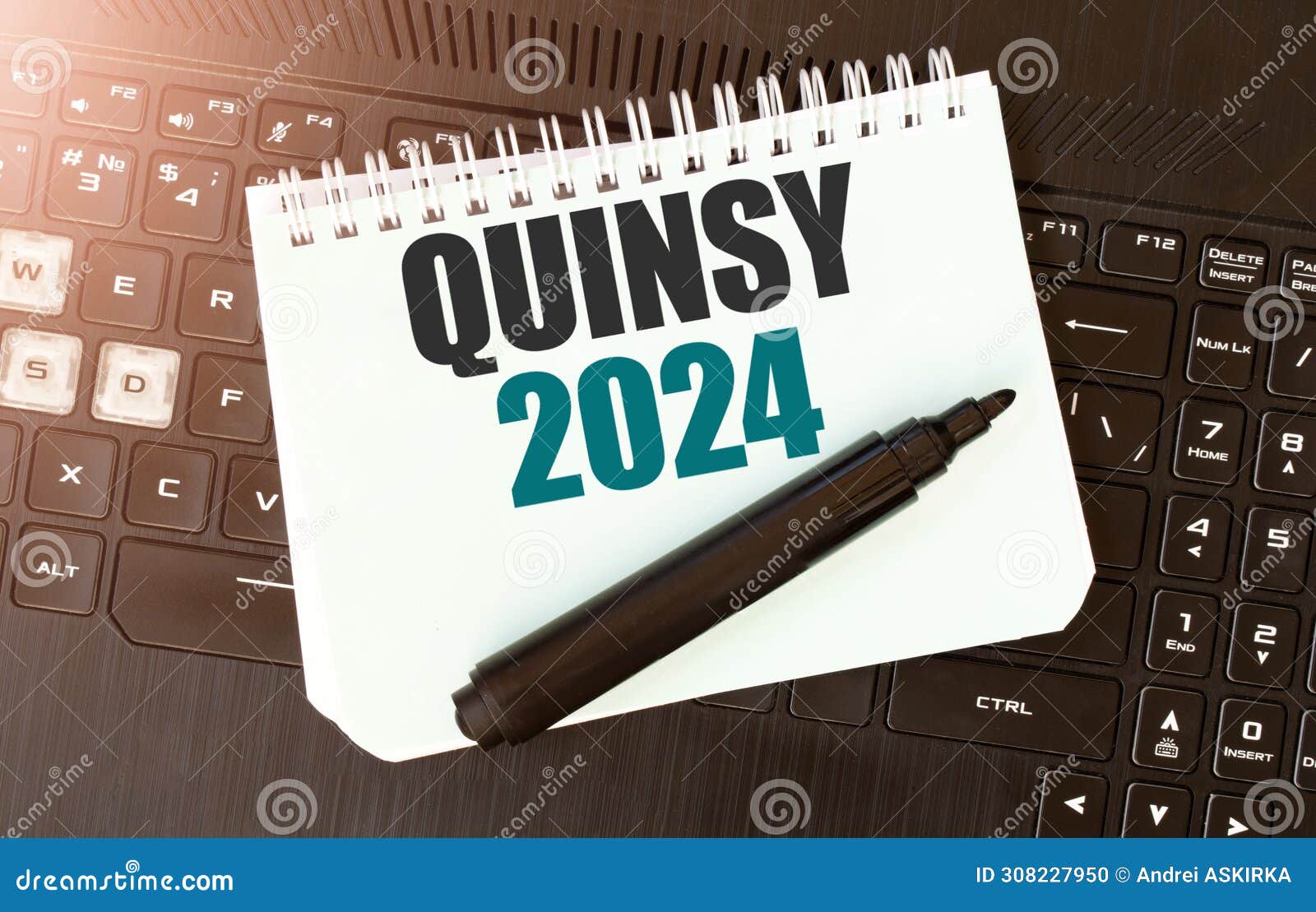 White Paper Sheet with Text QUINSY 2024 on the Black Laptop Stock Photo ...
