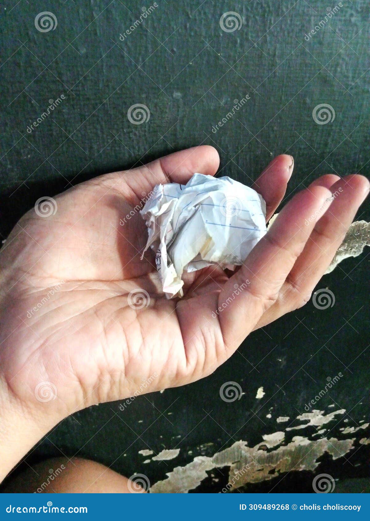 White paper trash on hand stock photo. Image of paper - 309489268