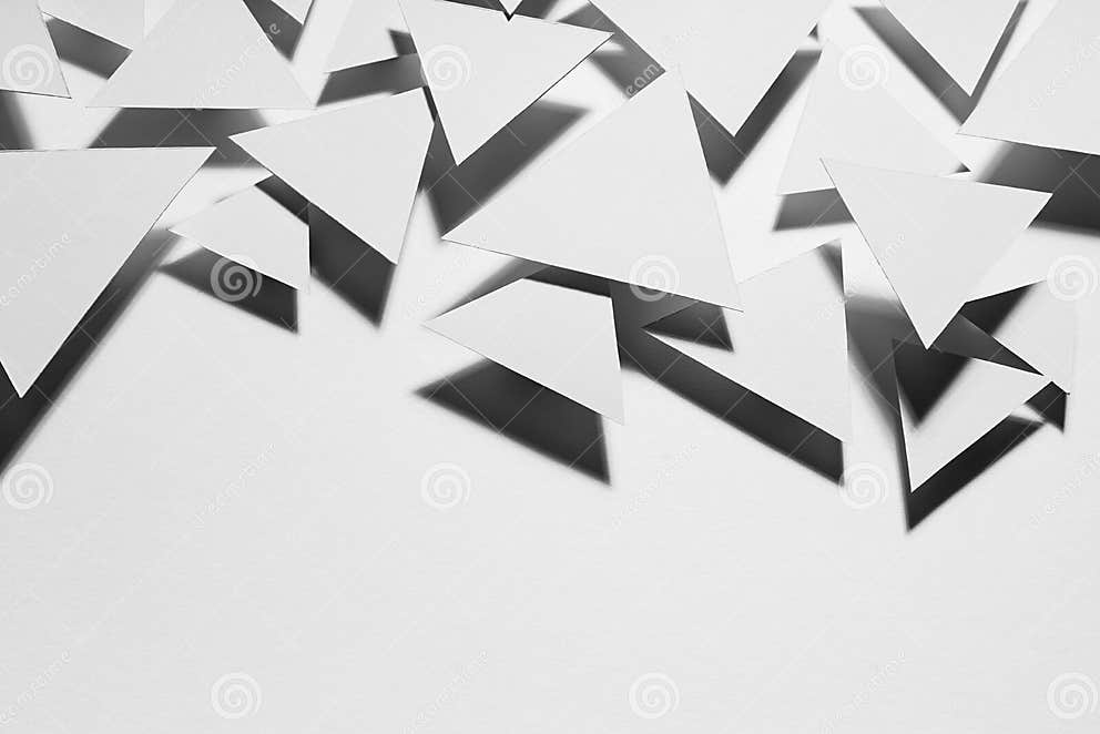 White Paper Triangles As Abstract Pattern in Bright Light with Black ...