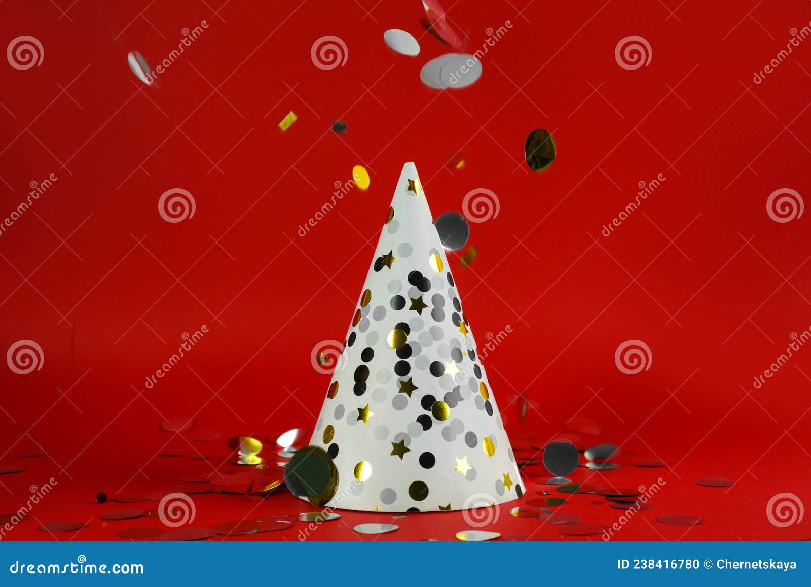White Party Hat and Confetti on Red Background Stock Photo - Image of ...