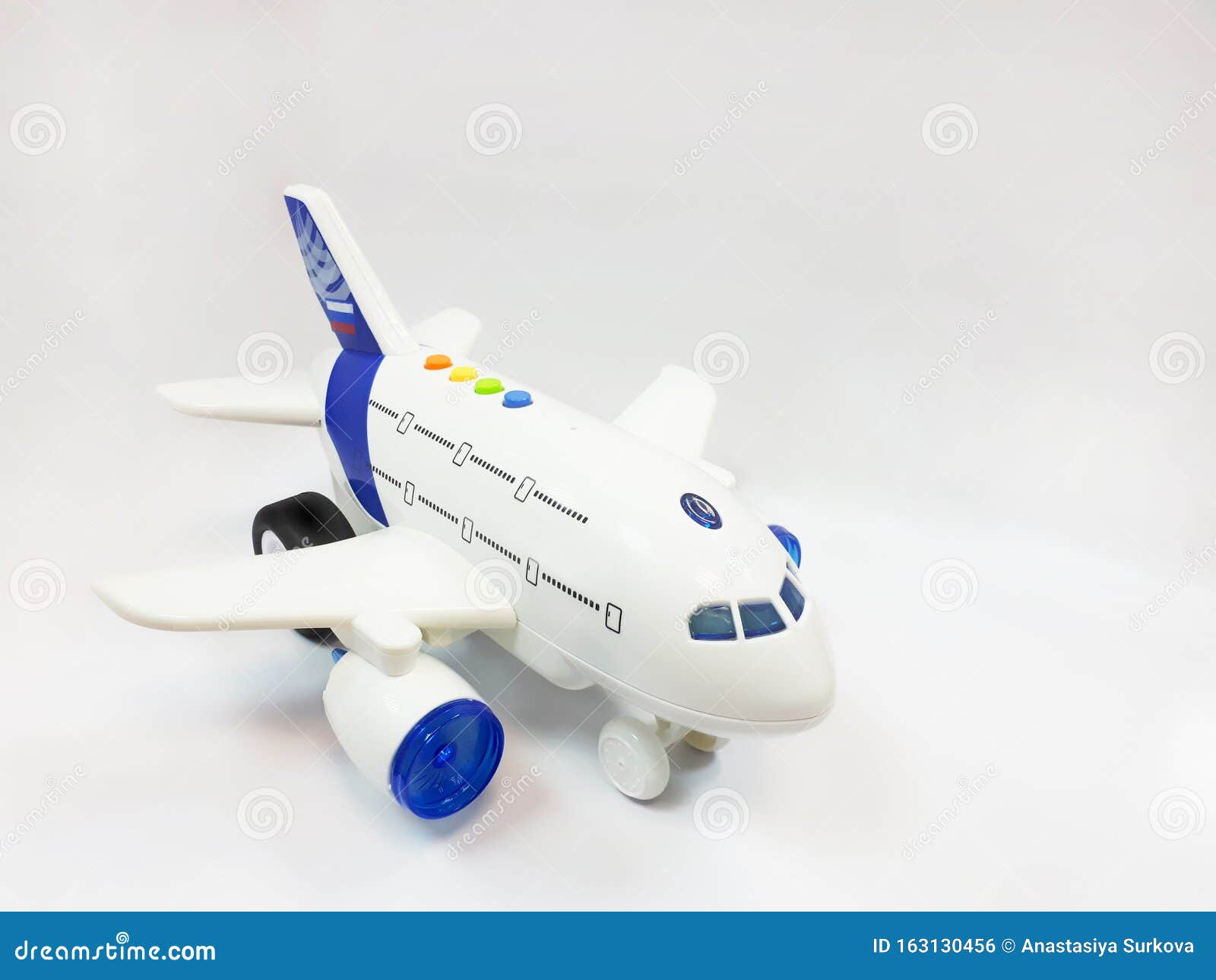 White Passenger Plane - A Children`s Toy, A Model With Buttons On A ... White Passenger Plane - A Children`s Toy, A Model With Buttons On A ...