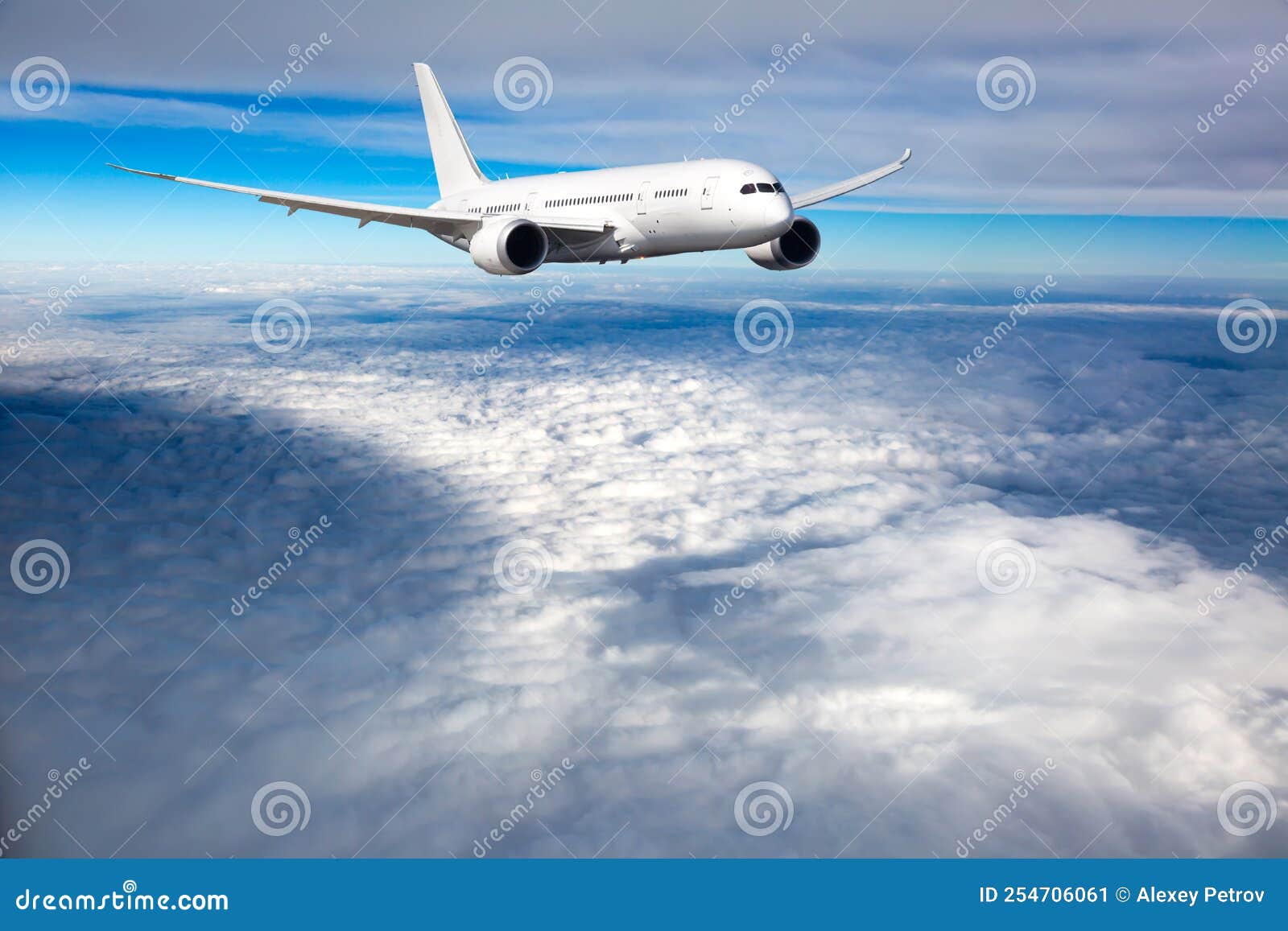 White Passenger Plane in Flight. Aircraft Fly Above the Clouds. Front ...