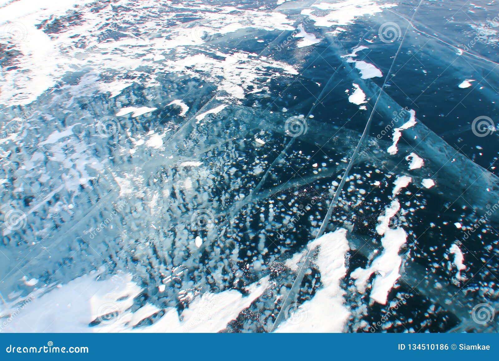 White Pattern of Frozen Bubbles in Thick Dark-blue Ice Stock Photo ...