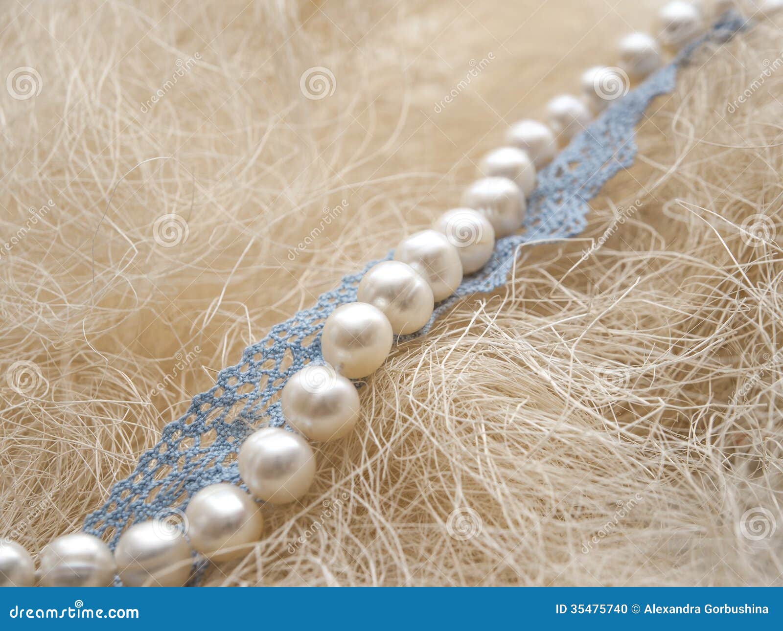 White Pearl and Blue Lace on Straw Stock Photo - Image of accessories ...