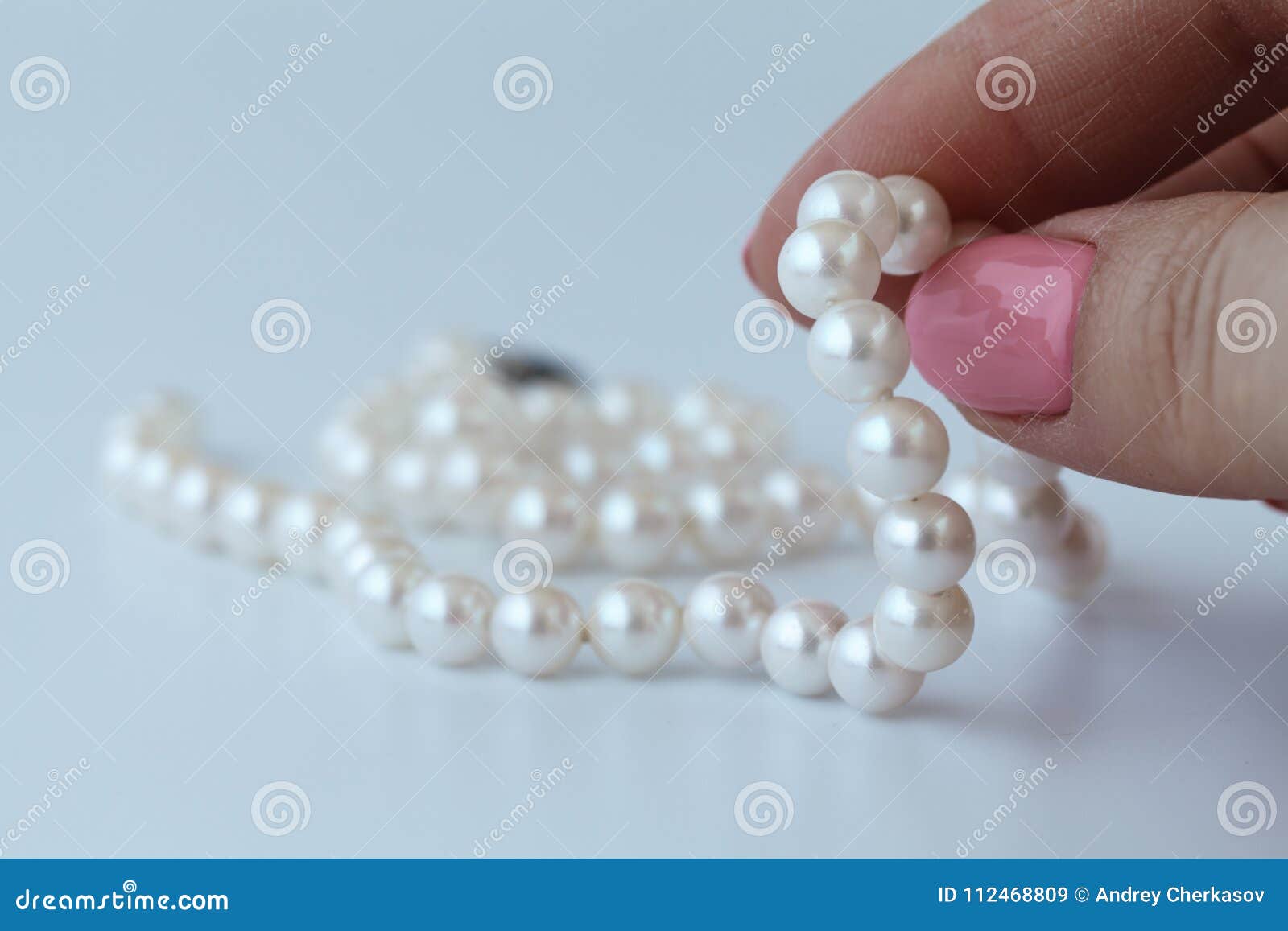 White pearl in female hand stock image. Image of beauty - 112468809
