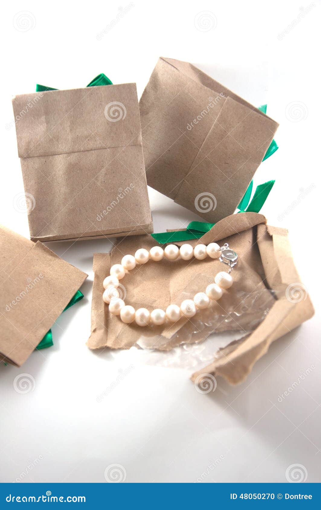 White pearl in paper bag stock photo. Image of pearl - 48050270