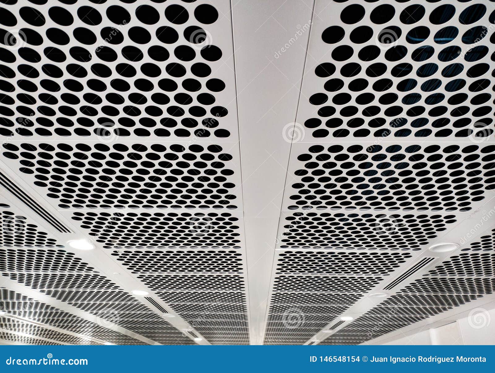 White perforated ceiling stock photo. Image of detail - 146548154