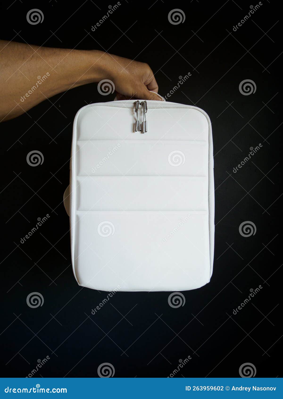 White Photo Backpack in Hand. Front View.. Stock Photo - Image of ...