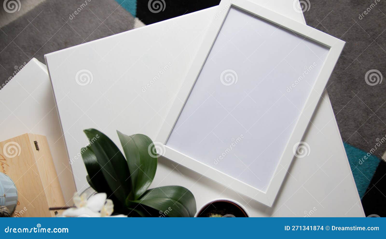 White Photo Frame on the Table. White Blank Photo Frame on the Table ...