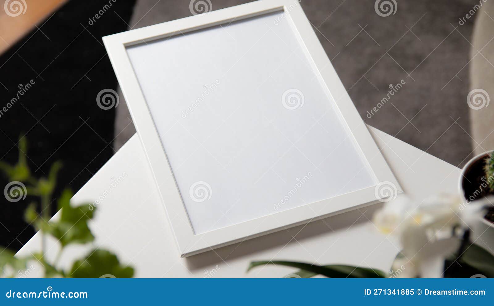 White Photo Frame on the Table. White Blank Photo Frame on the Table ...