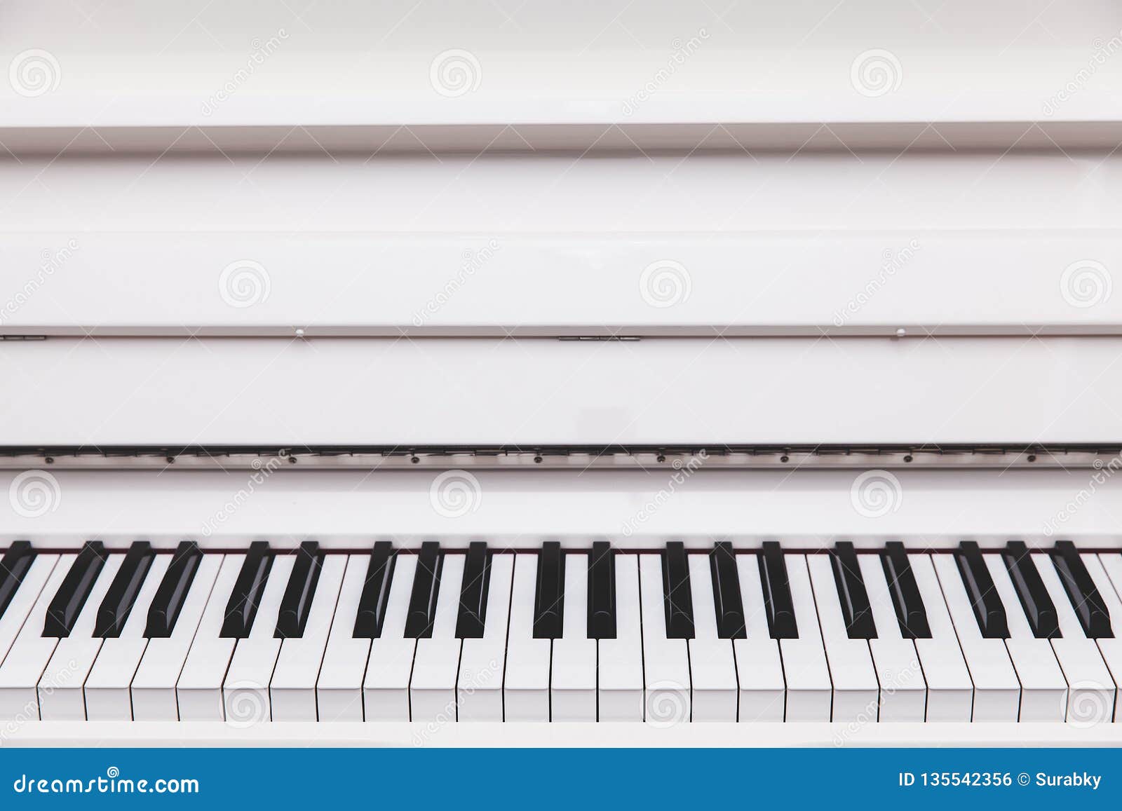 White piano keyboard rows stock photo. Image of keyboard - 135542356