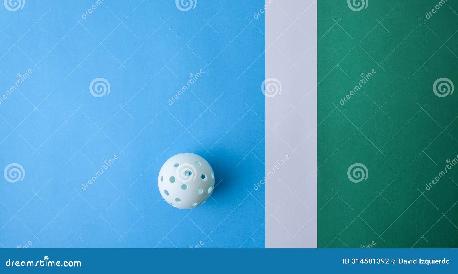 White Pickleball Ball on Blue and Green Playing Surface Stock Photo ...