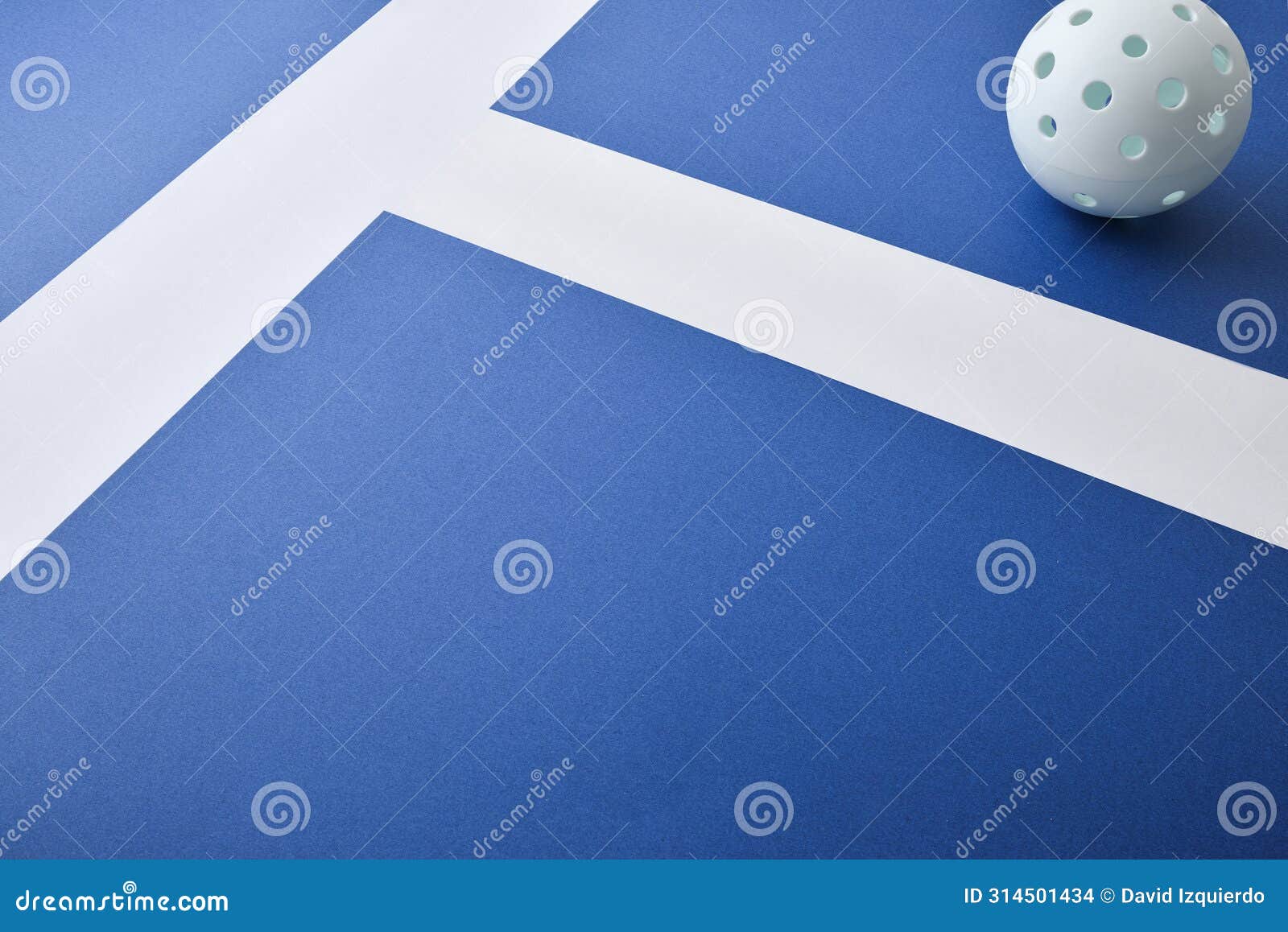 White Pickleball Ball on Blue Playing Surface Elevated View Stock Photo ...