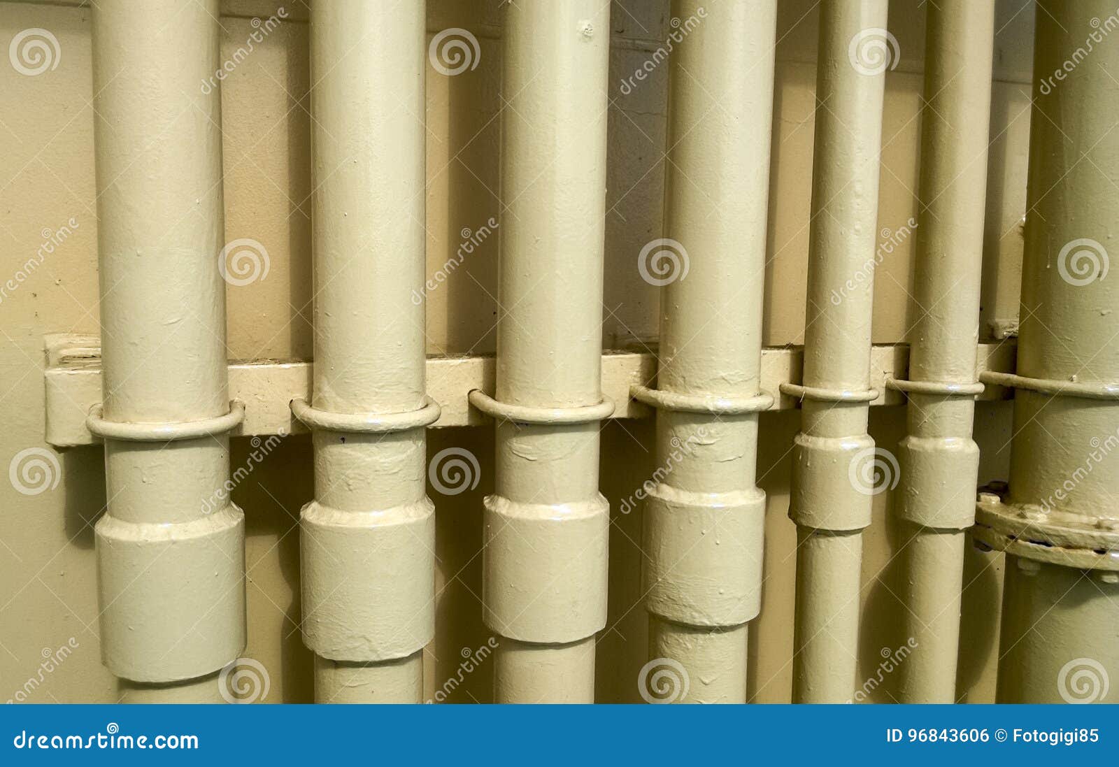 White Pipes Near the Wall. Flanged Connection on a Gray Pipe Stock ...