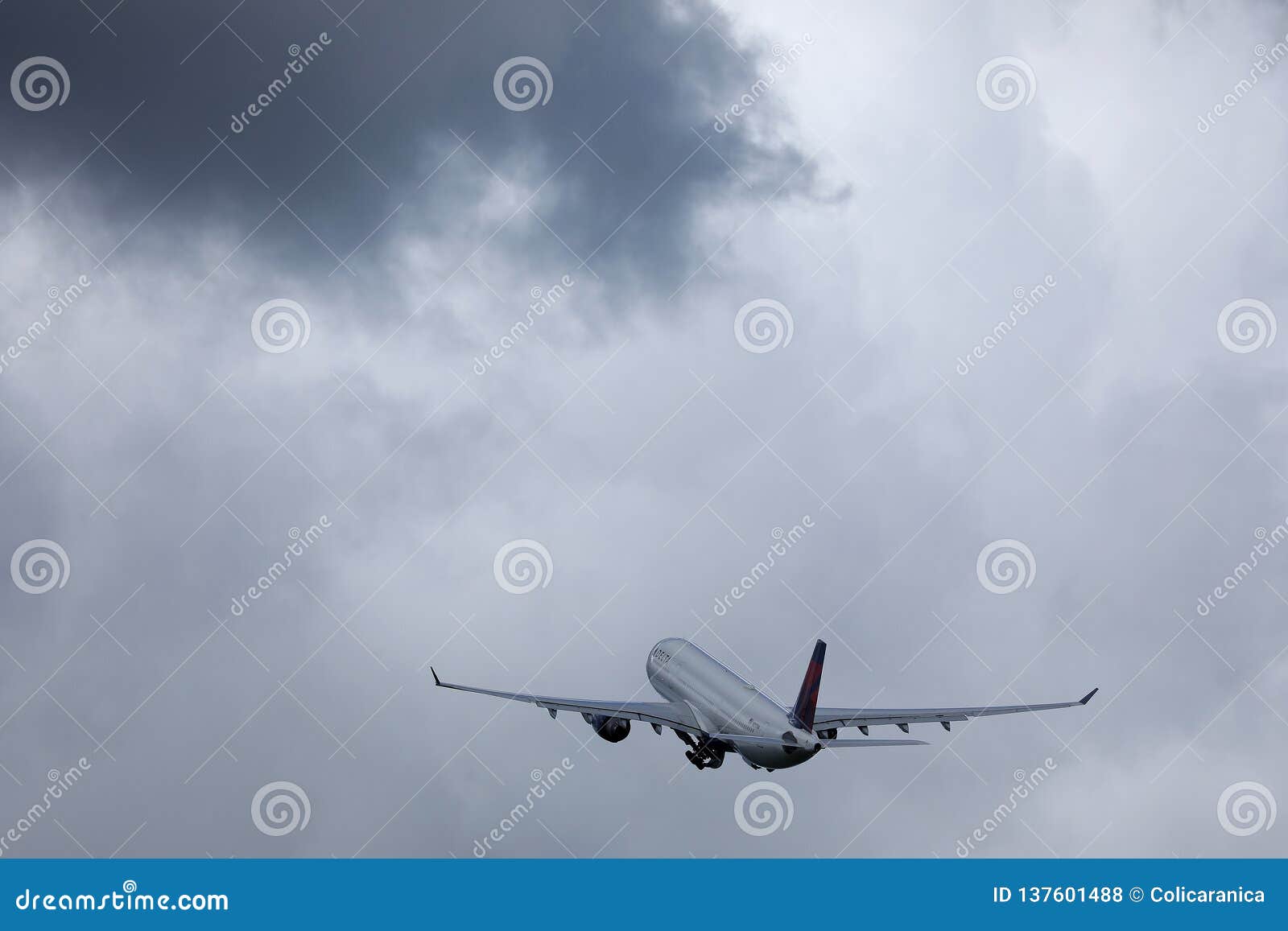 White Plane Flying Up in the Dark Sky Editorial Stock Photo - Image of ...