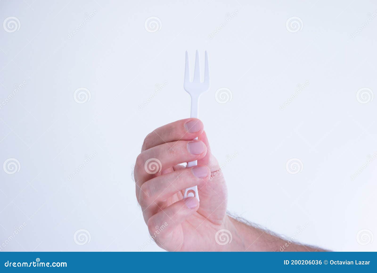White Plastic Disposable Fork Modeled by Caucasian Male Hand Isolated ...