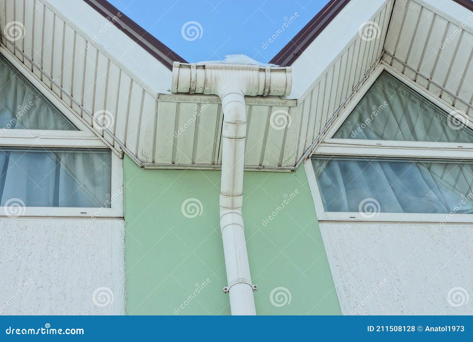White Plastic Gutter Pipe in the Snow Stock Photo - Image of material ...