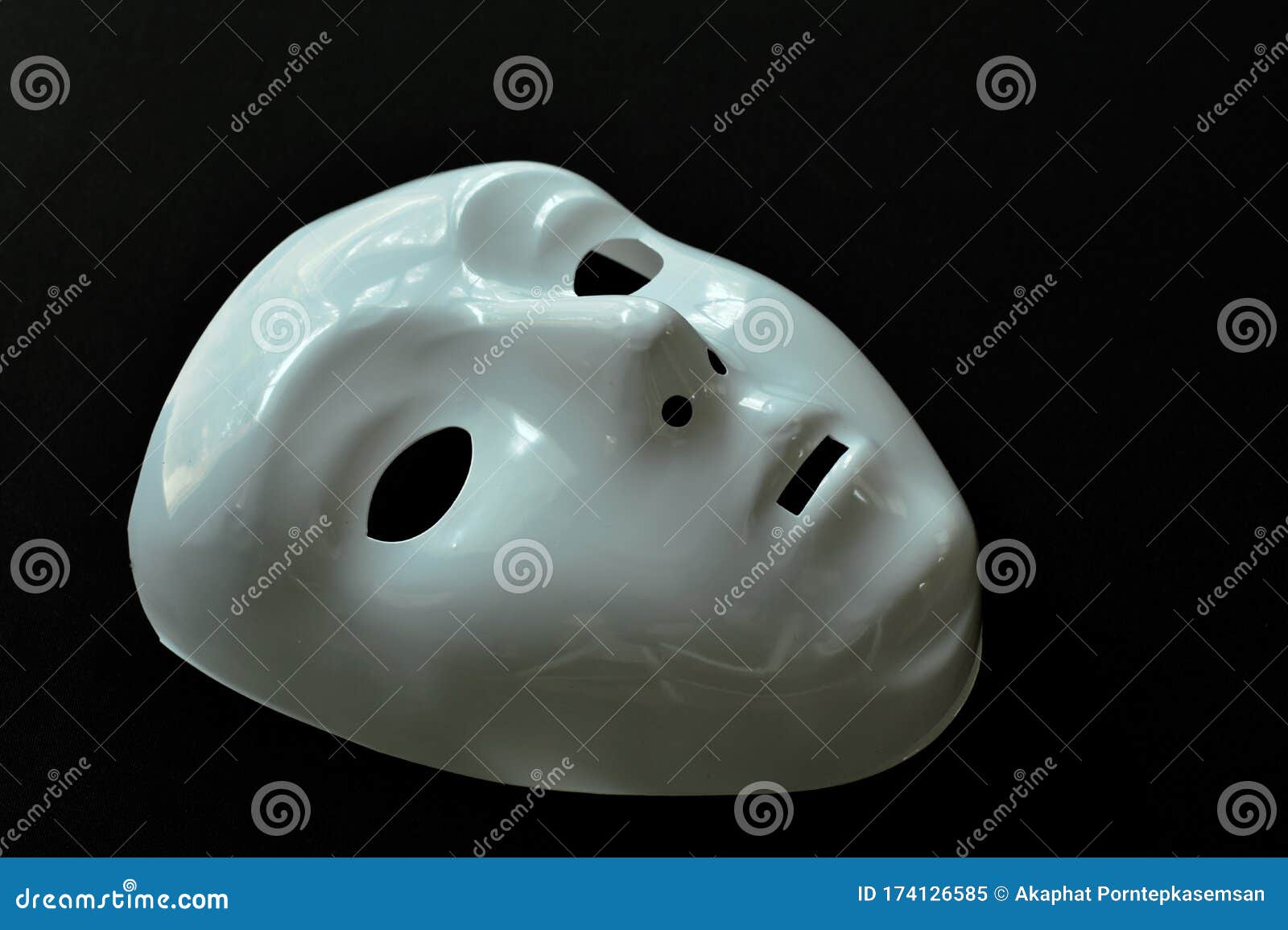 White Plastic Human Face Mask on Black Fabric Background Stock Image ...