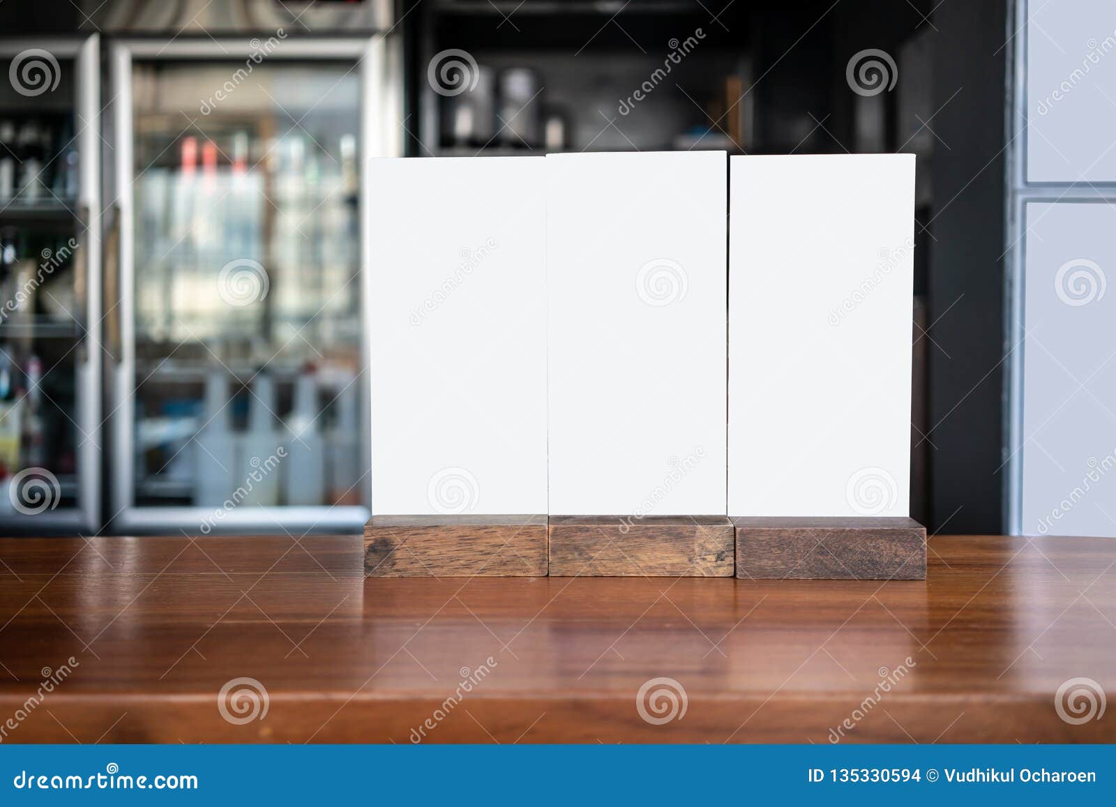 White Plastic Menu Board on Wooden Counter Table in Front of Kitchen ...
